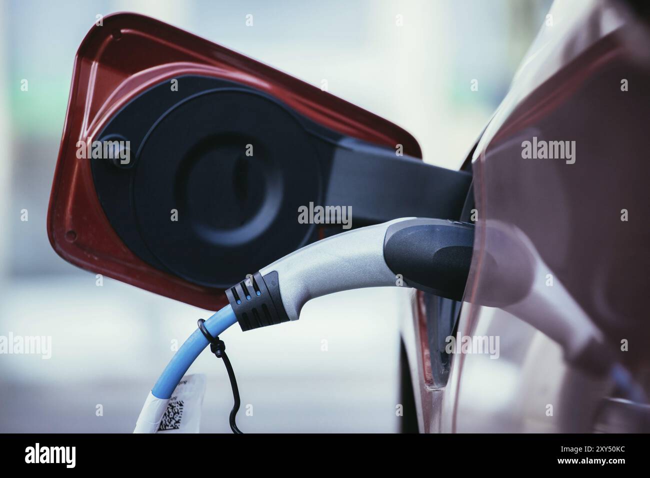 Electric car recharging with charge cable and plug leading to charge ...