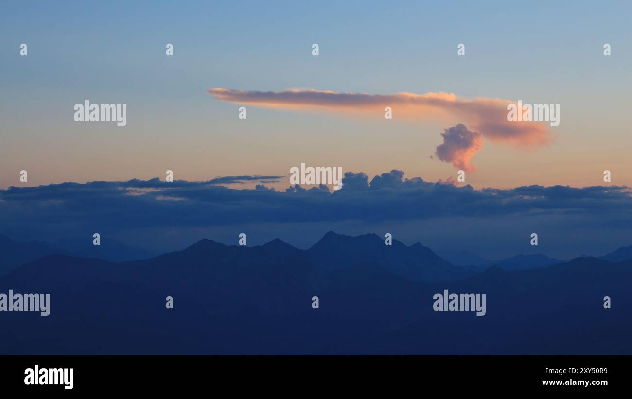 Overcast sunset above mountains hi-res stock photography and images - Alamy