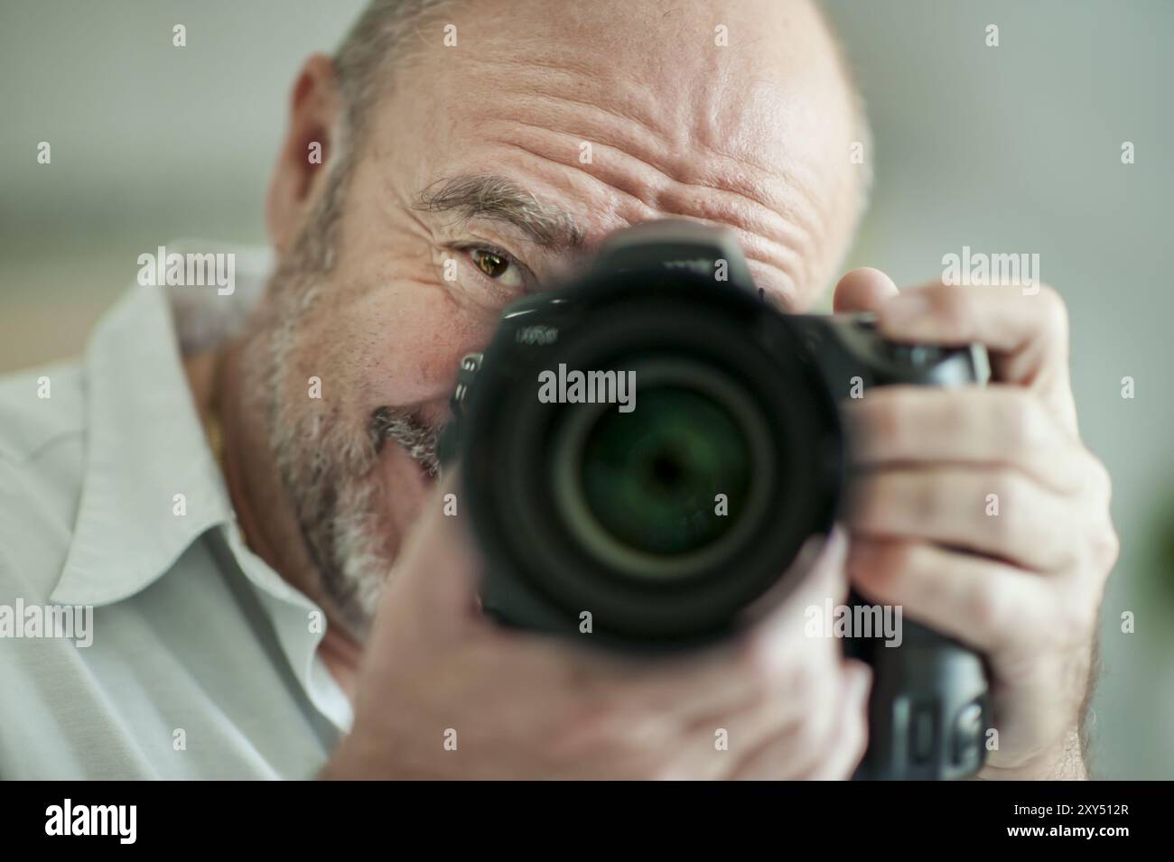 Portrait of a smiling photographer Stock Photo - Alamy