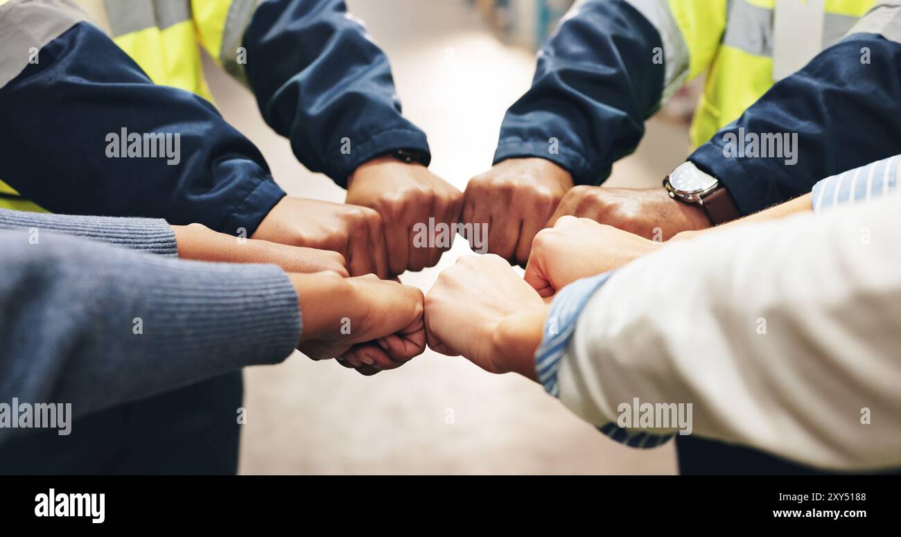 Group, people and teamwork with fist bump in warehouse for collaboration, trust and motivation ...