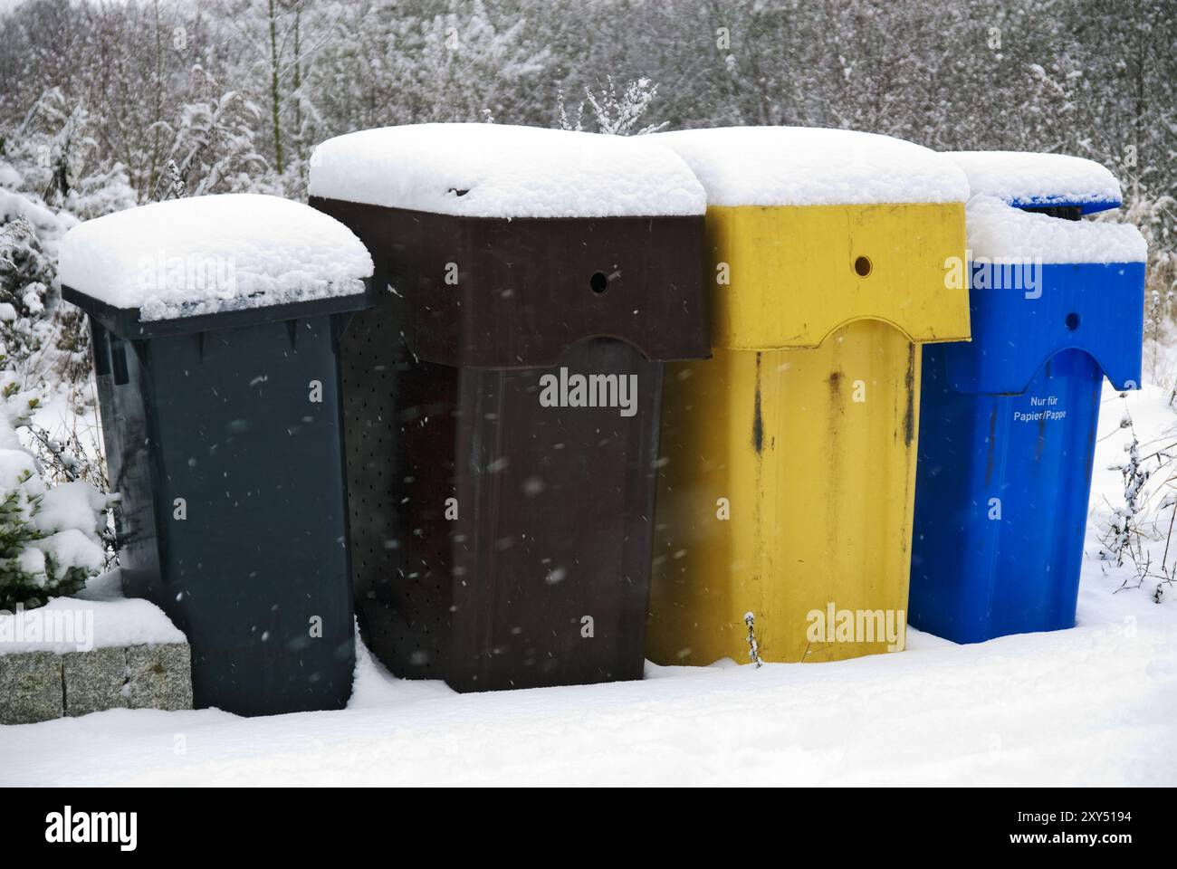 4 waste bins in a row Stock Photo - Alamy