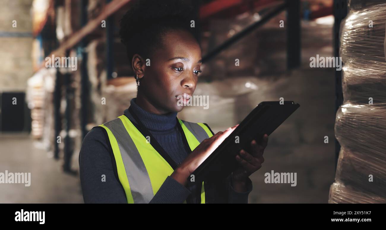 Logistics, black woman and tablet in warehouse for checklist ...