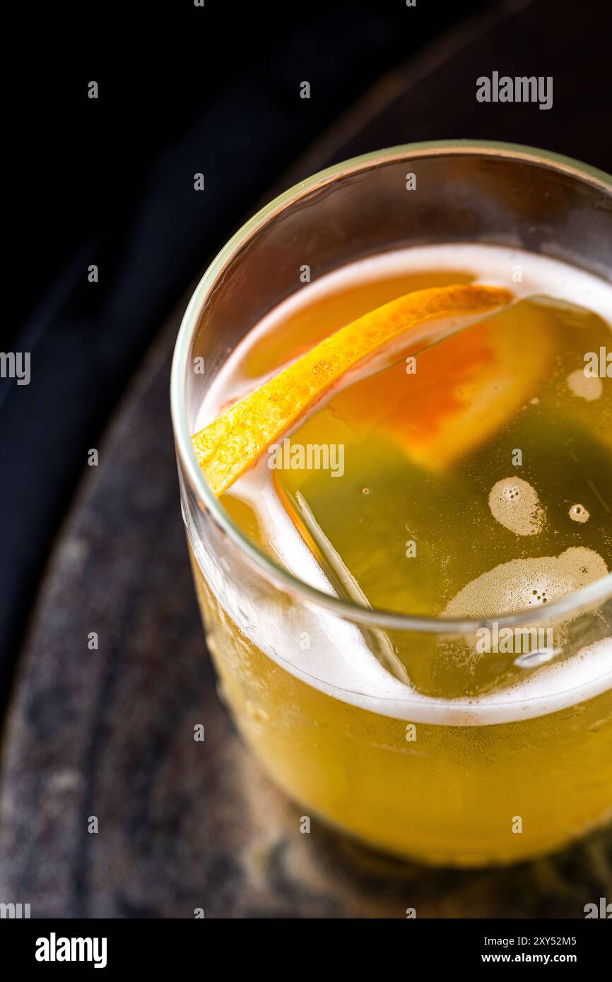 Satsuma cocktail in glass on dark background Stock Photo - Alamy