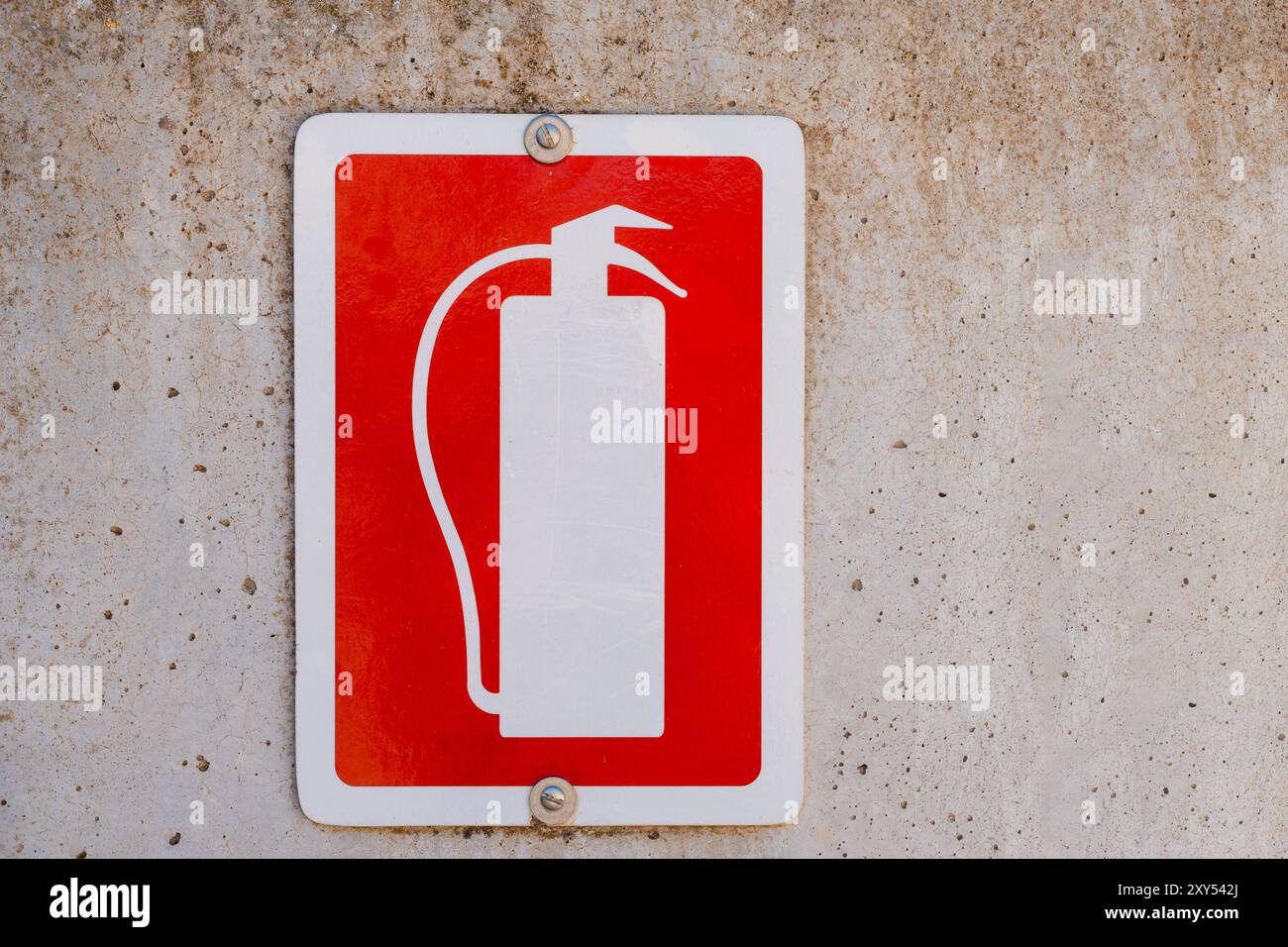 fire hydrant extinguisher sign fixed to wall of building Stock Photo ...