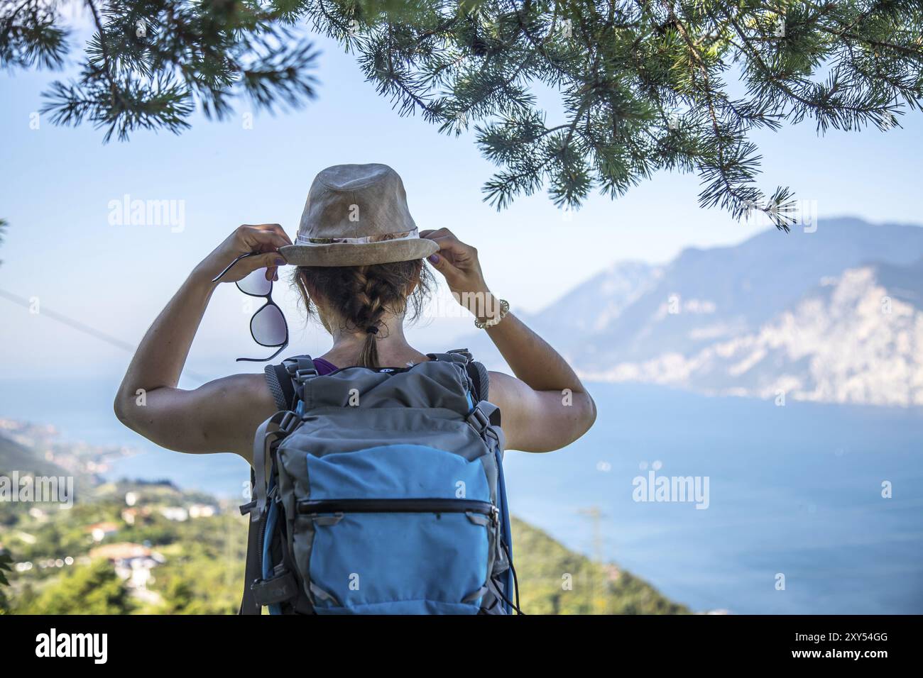 Hiking in Italy: Girl with straw hat is enjoying the view, summertime ...