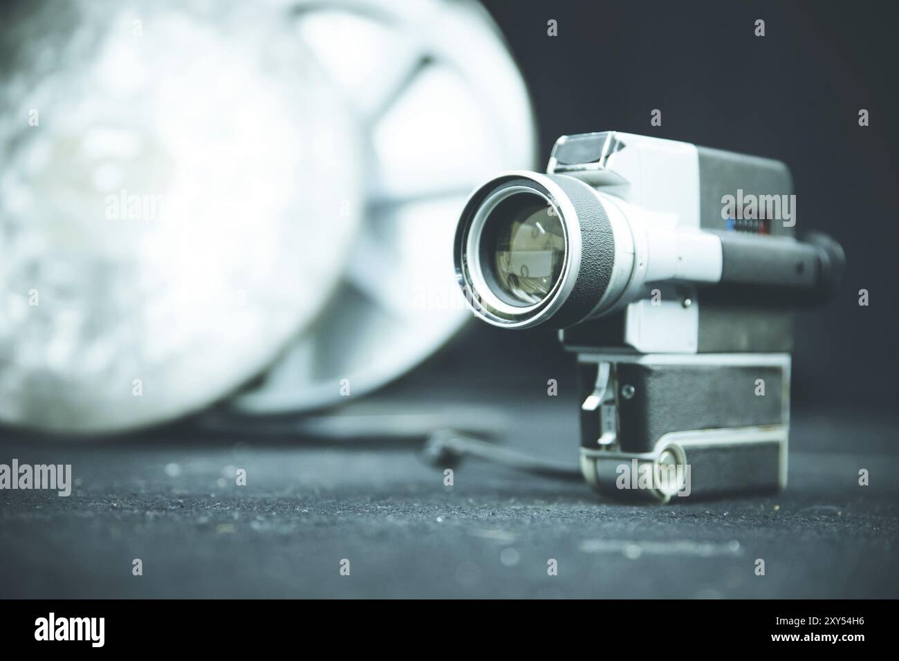 Vintage old movie camera, production studio in the blurry background ...