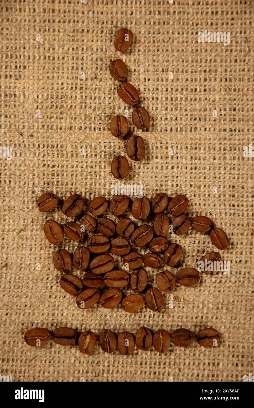 Conceptual artistic pattern of a cup of coffee made from coffee beans ...
