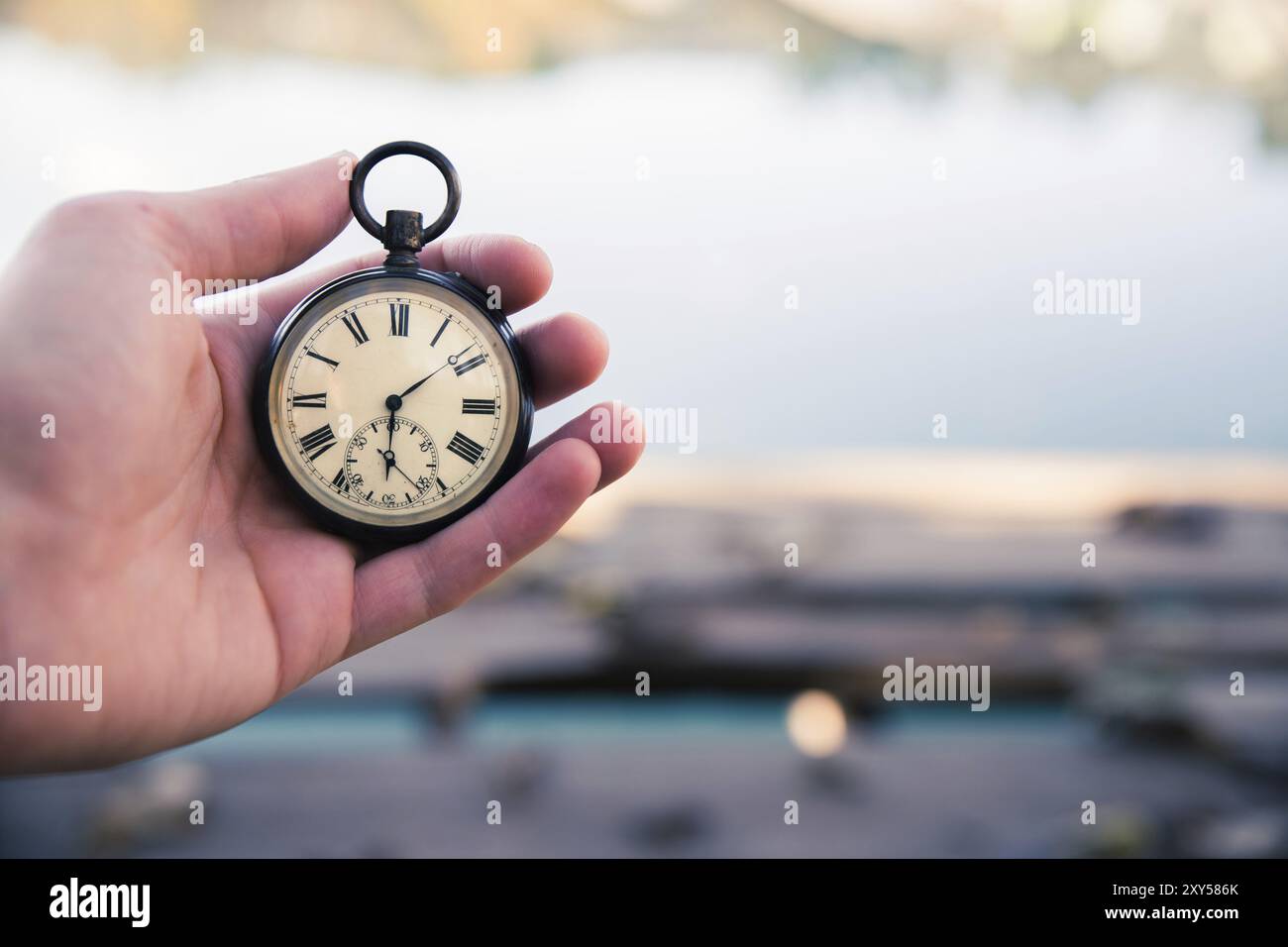 Hand held stop watch outdoors, autumn, blurry background Stock Photo ...