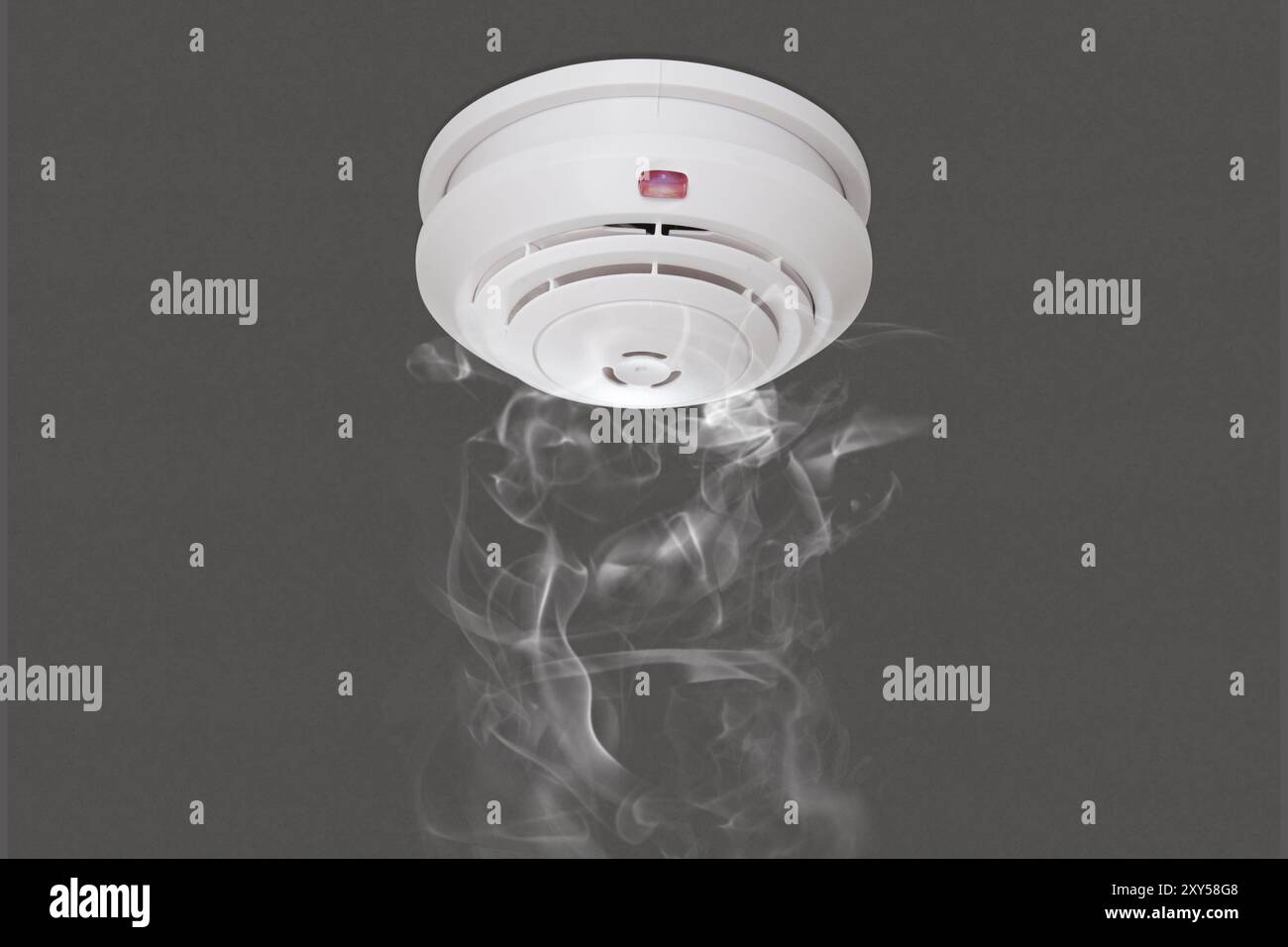 Smoke detector under the ceiling wall Stock Photo - Alamy