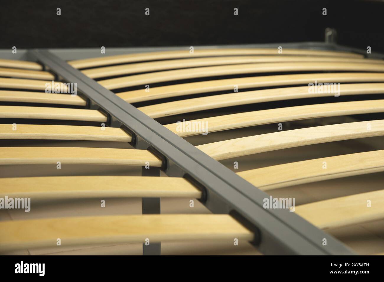 Close-up wooden elements of an arthopedic base of a double bed ...