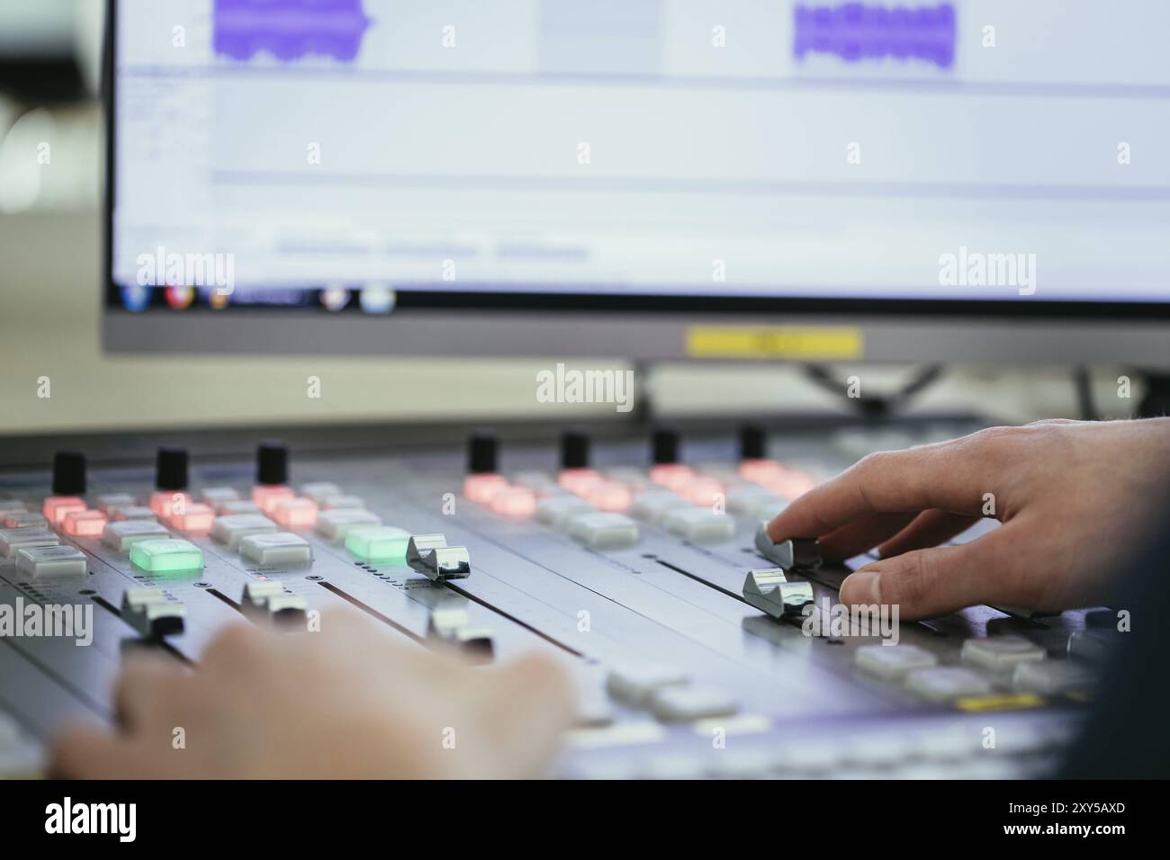 Moderator and soundboard in radio broadcasting studio Stock Photo - Alamy