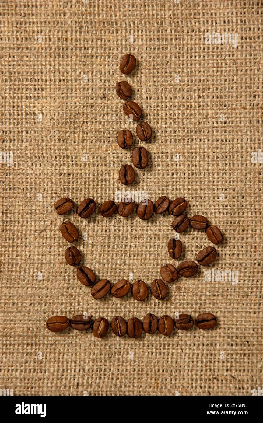 Conceptual artistic pattern of a cup of coffee made from coffee beans ...
