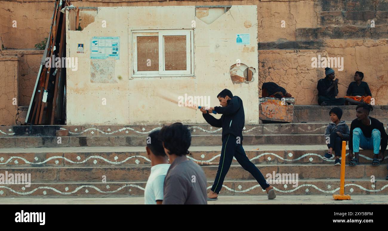 Varanasi, India. Young Guys Playing Cricket On Steps Of Ganges ...