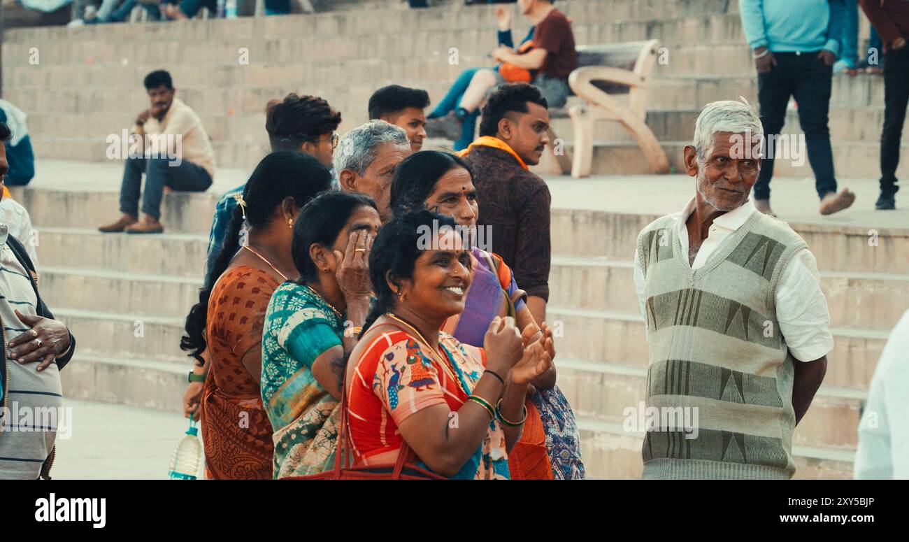 Varanasi, India. Group Of Pilgrims On Steps Of Ghat In Varanasi. Woman ...