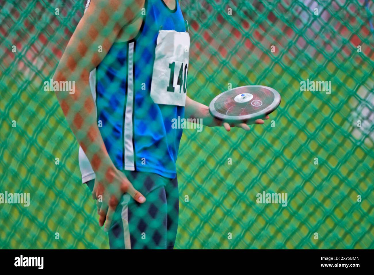 Discus thrower holding his discus in his hand Stock Photo - Alamy