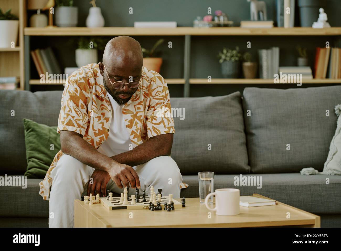 Gen Y African American Man Solving Chess Composition Stock Photo - Alamy