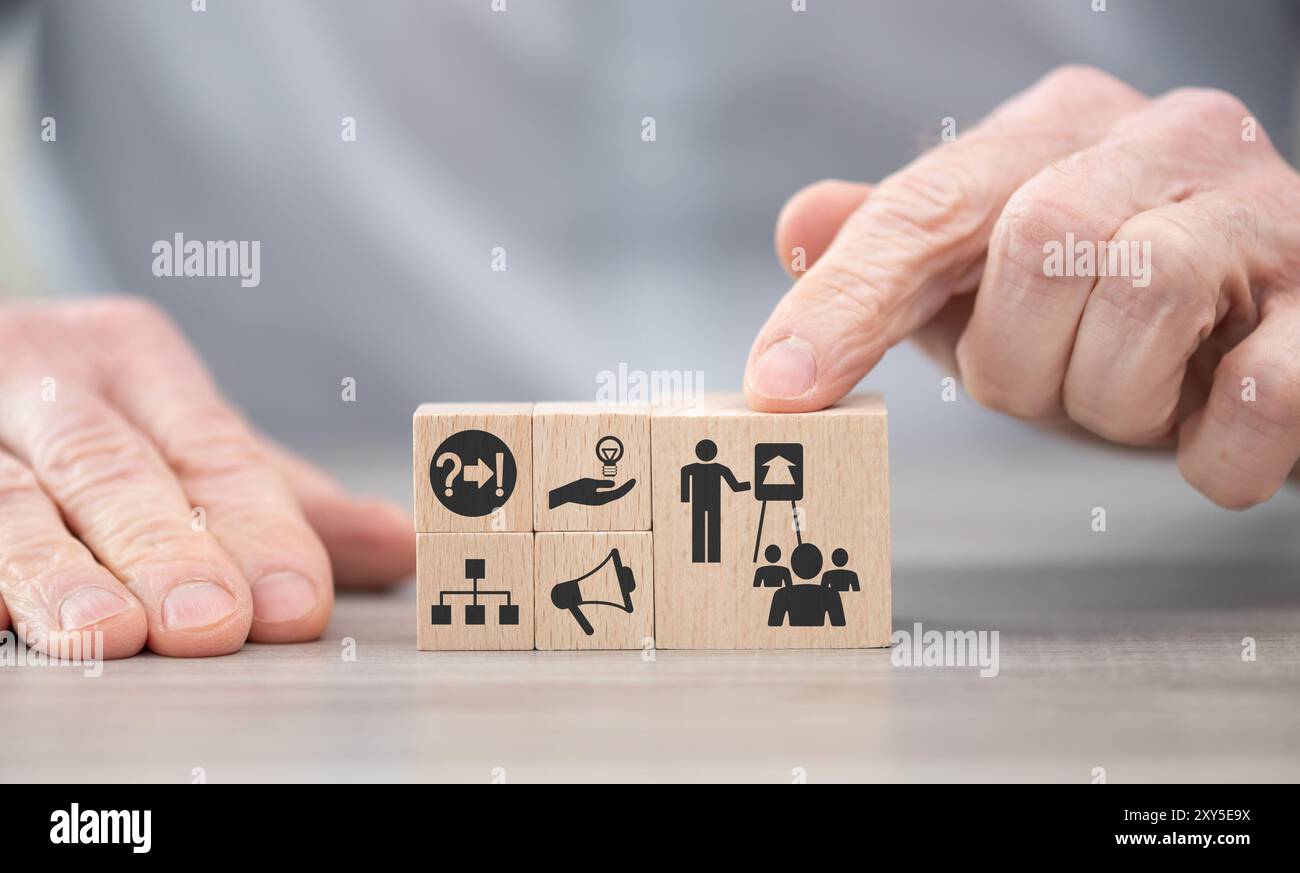 Wooden blocks with symbol of coaching concept Stock Photo - Alamy