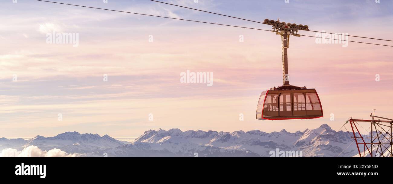 Chamonix Mont Blanc, France cable car cabin at Aiguille du Midi and pink sunset sky, French Alps ...