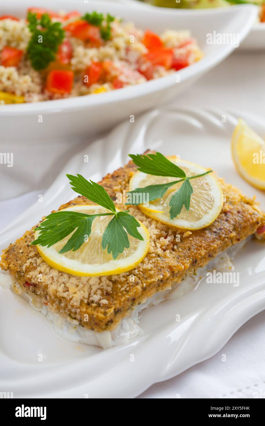 Baked fish fillet with fresh couscous salad Stock Photo - Alamy