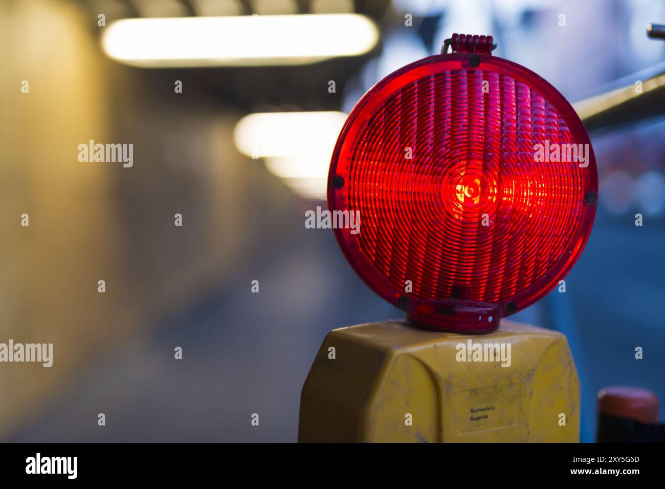 Red warning light in front of a construction site Stock Photo - Alamy