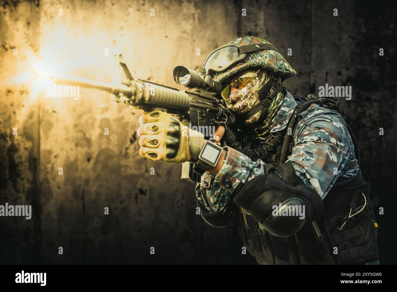 Special Forces soldier shooting with a gun in his hand Stock Photo - Alamy