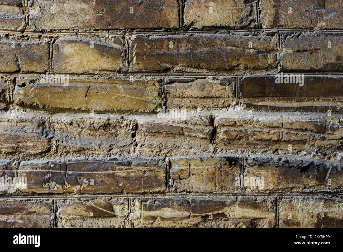 Textured background of old brick masonry pale yellow with deep ...