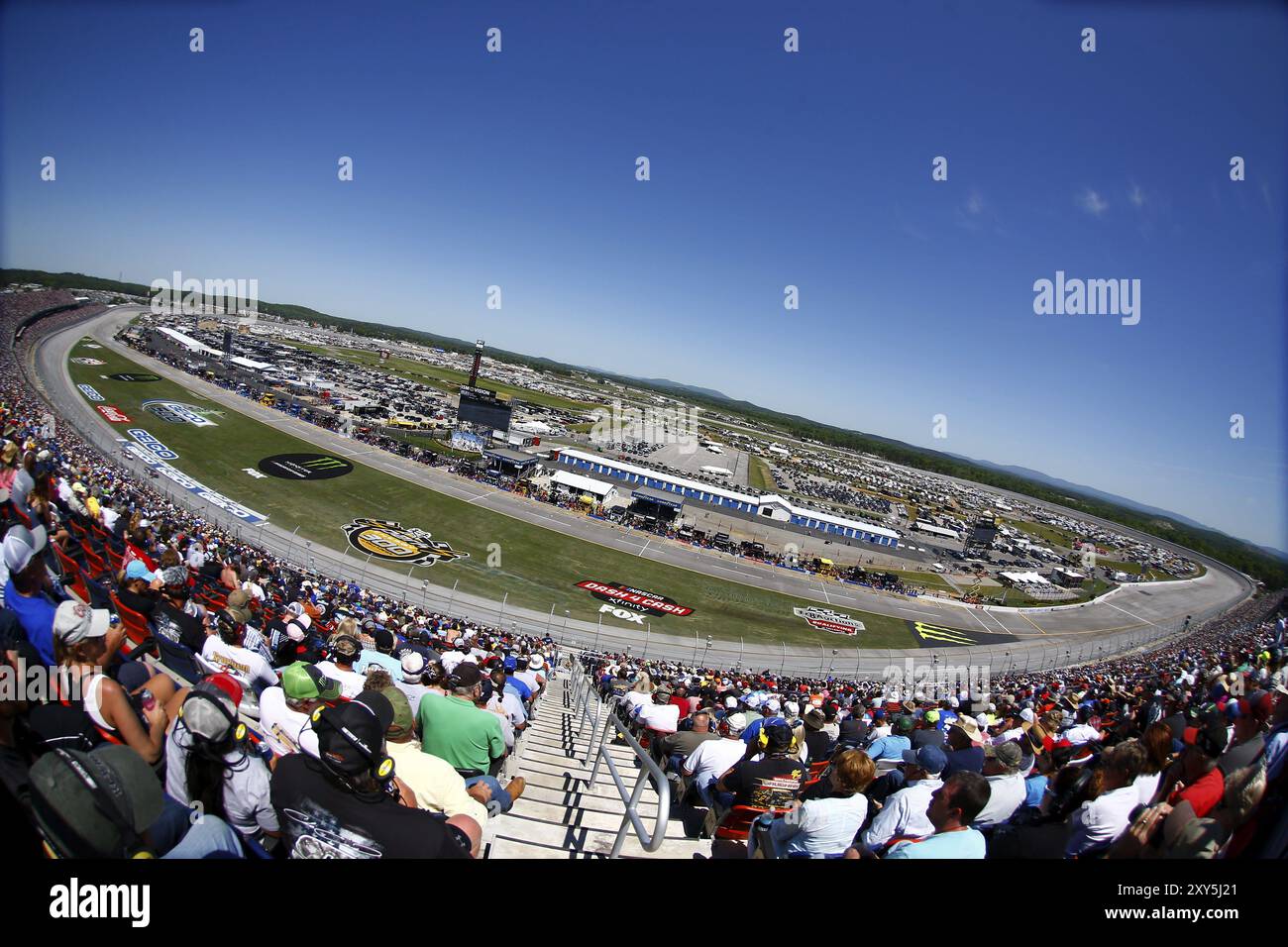 The Monster Energy NASCAR Cup Series cars race down the frontstretch ...