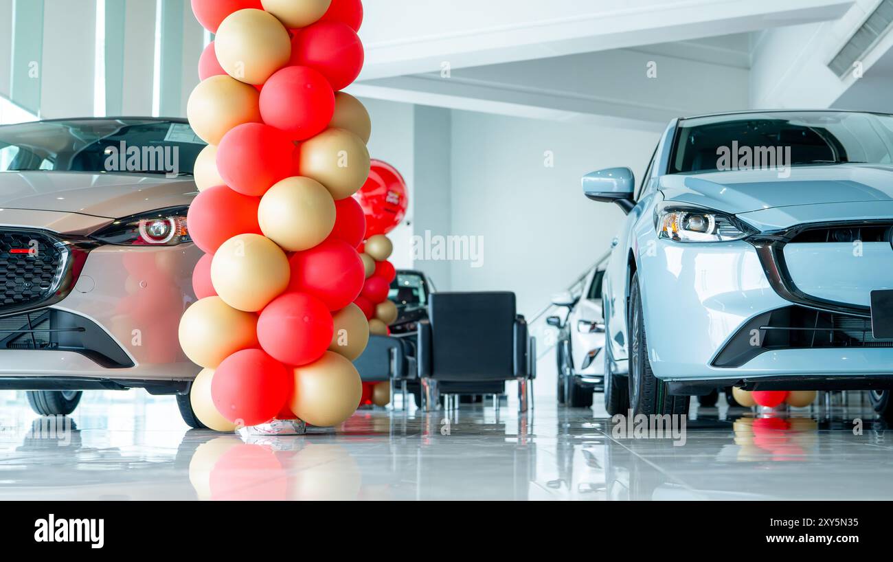 Front view of car parked in luxury showroom. Car dealership office. New ...