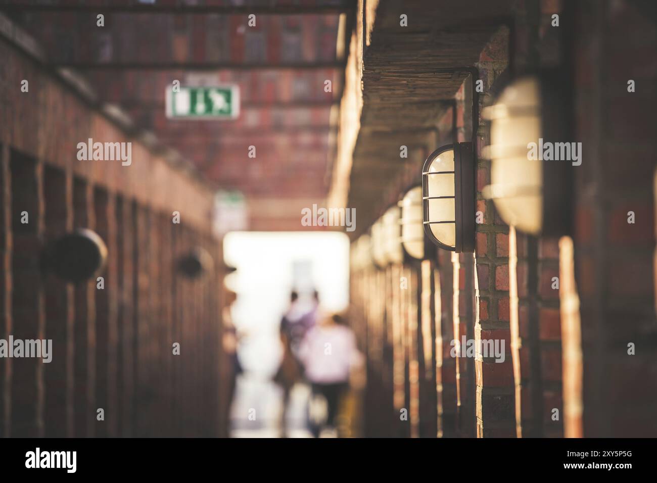 Lamps on a masoned building, blurry background with people Stock Photo ...