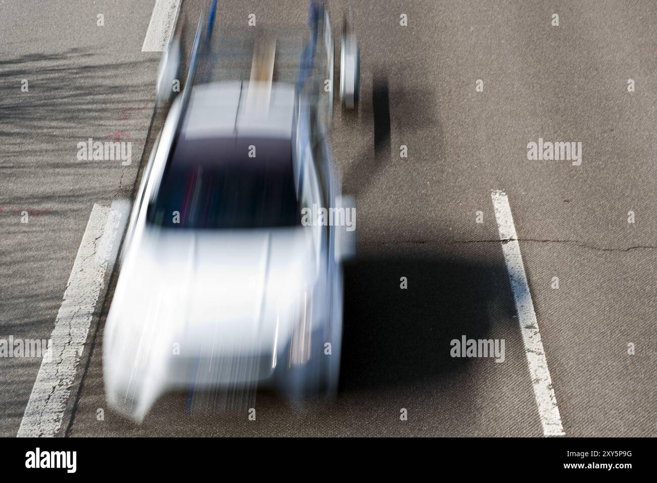 Fast-moving car with trailer under supervision Stock Photo - Alamy