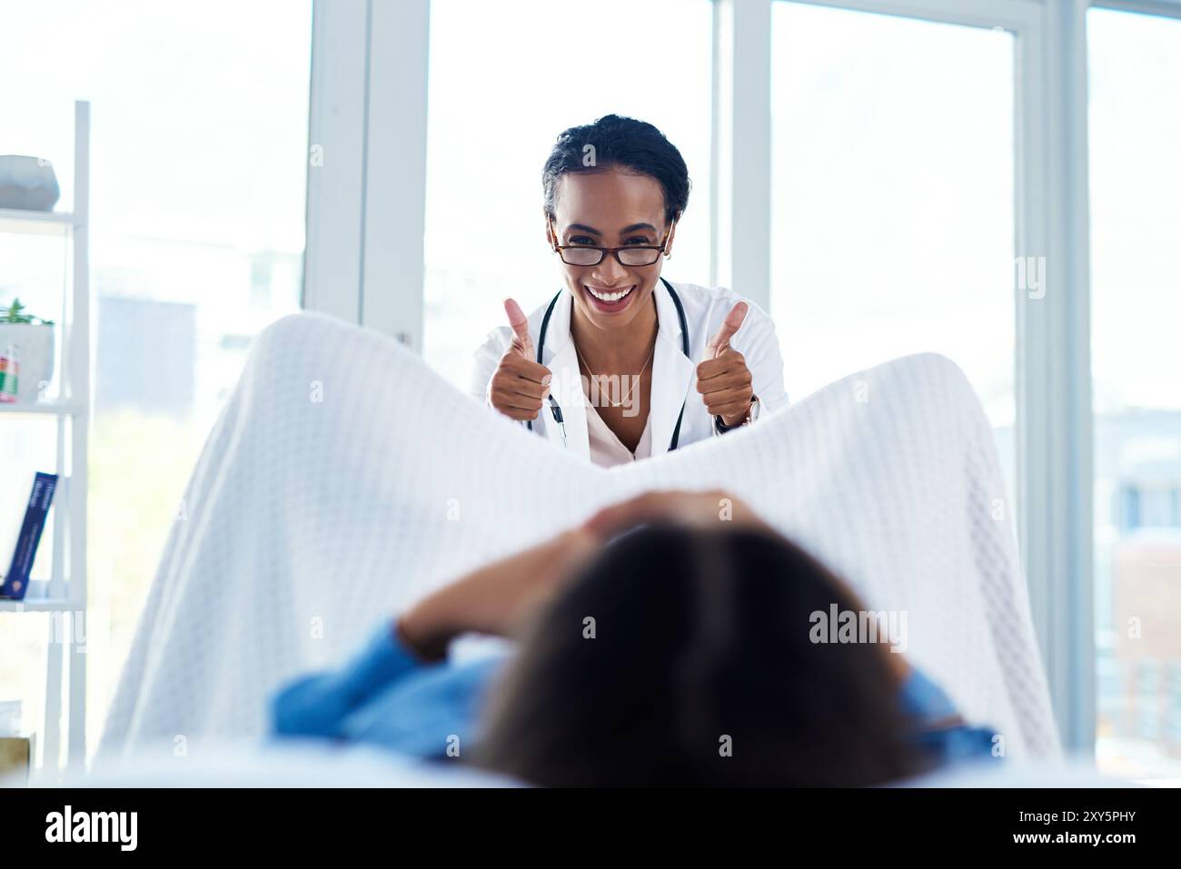 Thumbs up, patient and gynecologist for consultation, diagnosis or ...