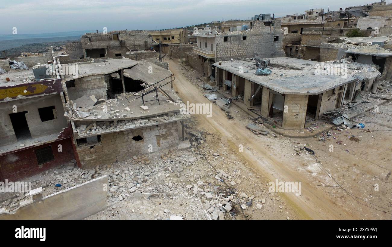February. Severely damaged buildings in the village of Takad following ...