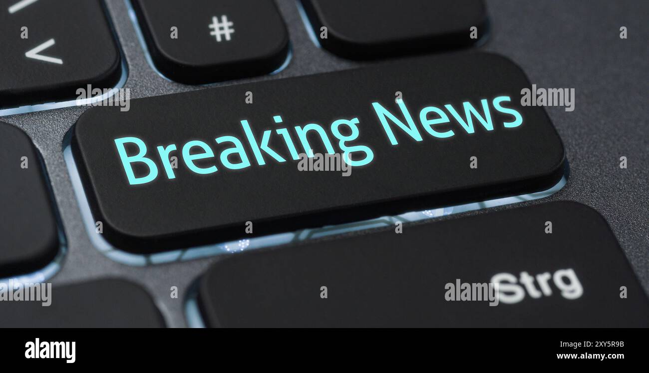 Illuminated keyboard with a labeled key - Breaking News Stock Photo - Alamy