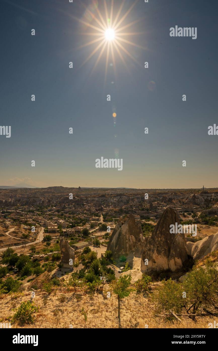 Stunning view of Cappadocia's iconic rock formations under a bright sun ...