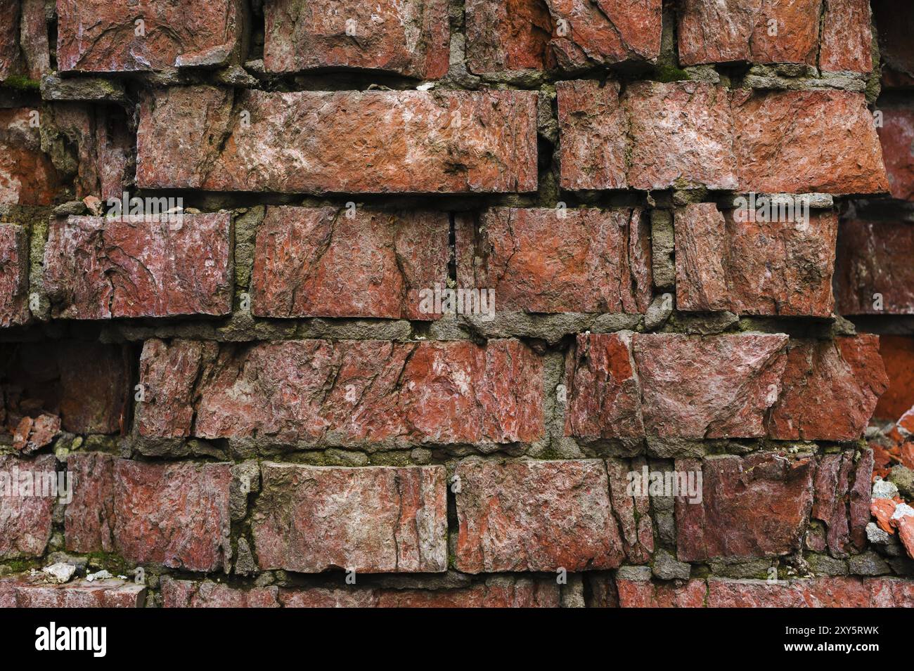 Grunge background Old brick wall weathered and falling apart. The ...