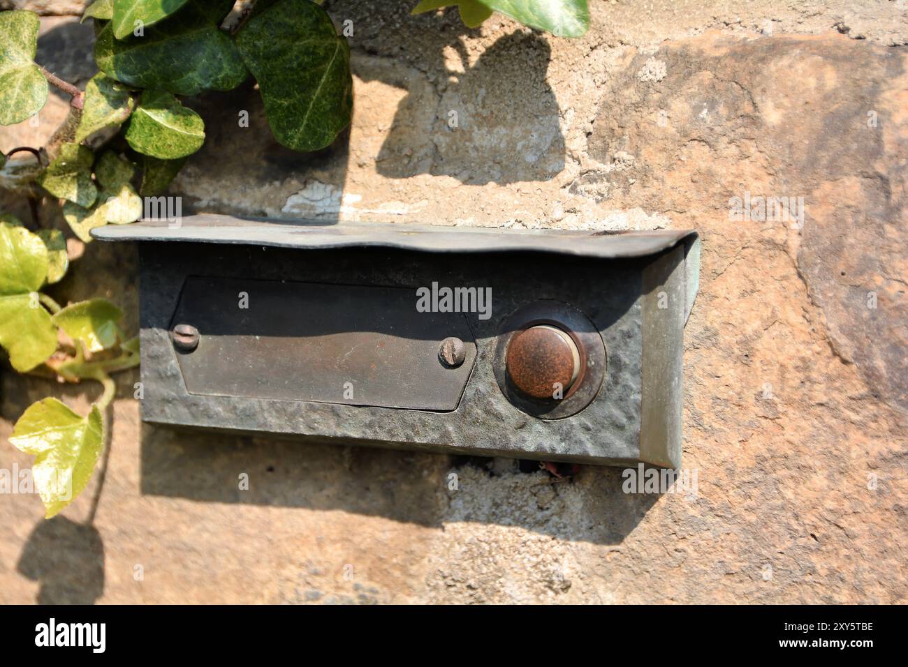 Doorbell button on an old building Stock Photo - Alamy