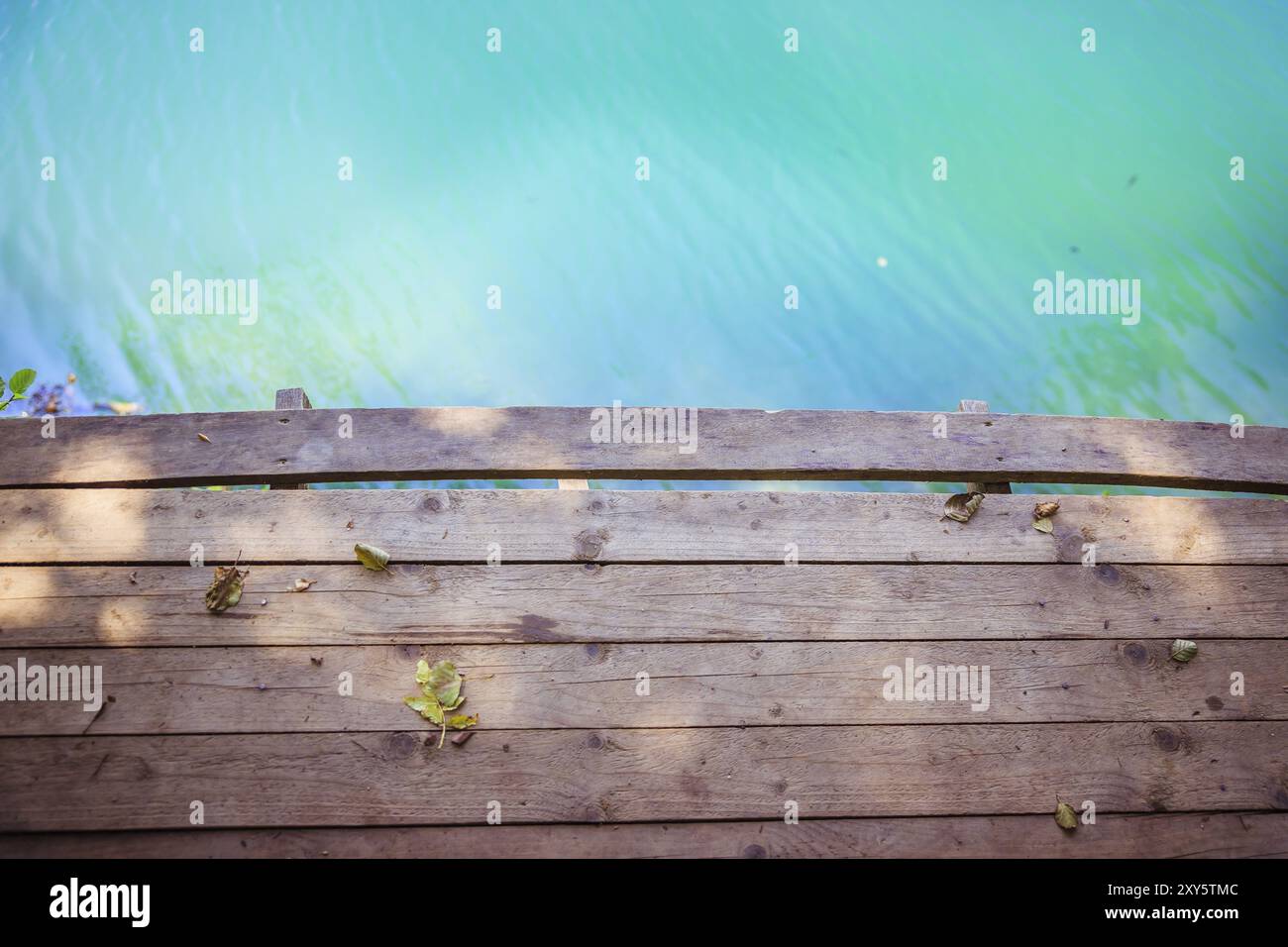 Rustic wooden dock pier and blue lake, text space Stock Photo - Alamy
