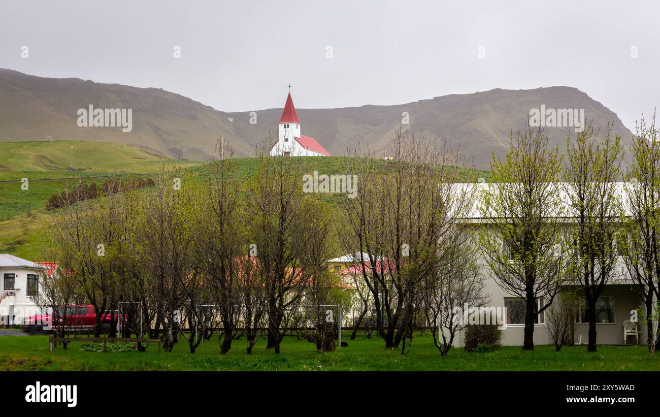 Vik i Mydral village landscape with residential buildings, trees and ...