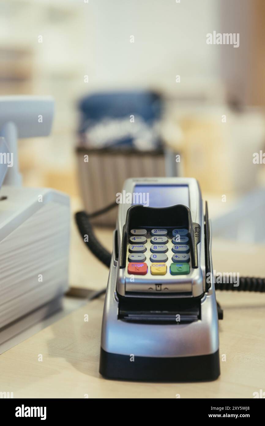 Cash register in a shop: Customer is paying purchase Stock Photo - Alamy