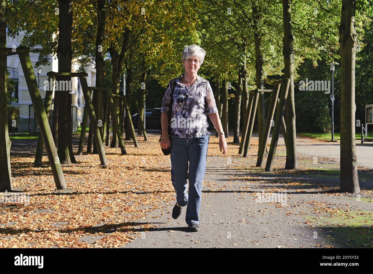 Woman takes walk through hi-res stock photography and images - Alamy