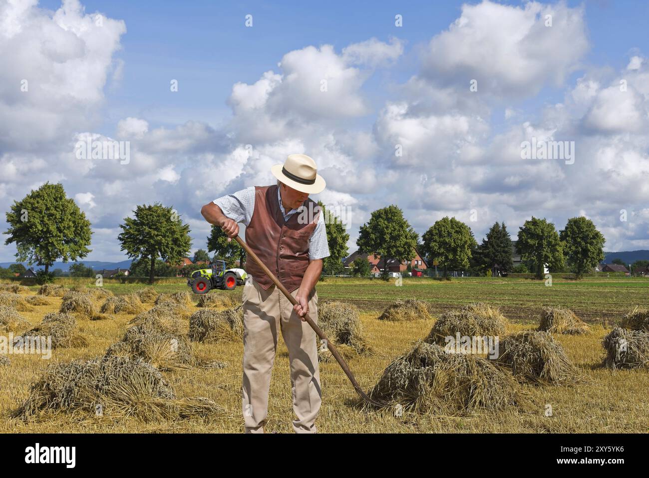 Farmer turning hay in hi-res stock photography and images - Alamy