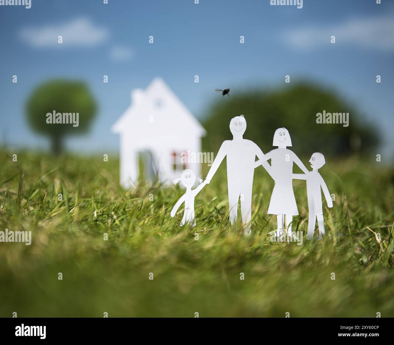 Paper family with house Stock Photo - Alamy