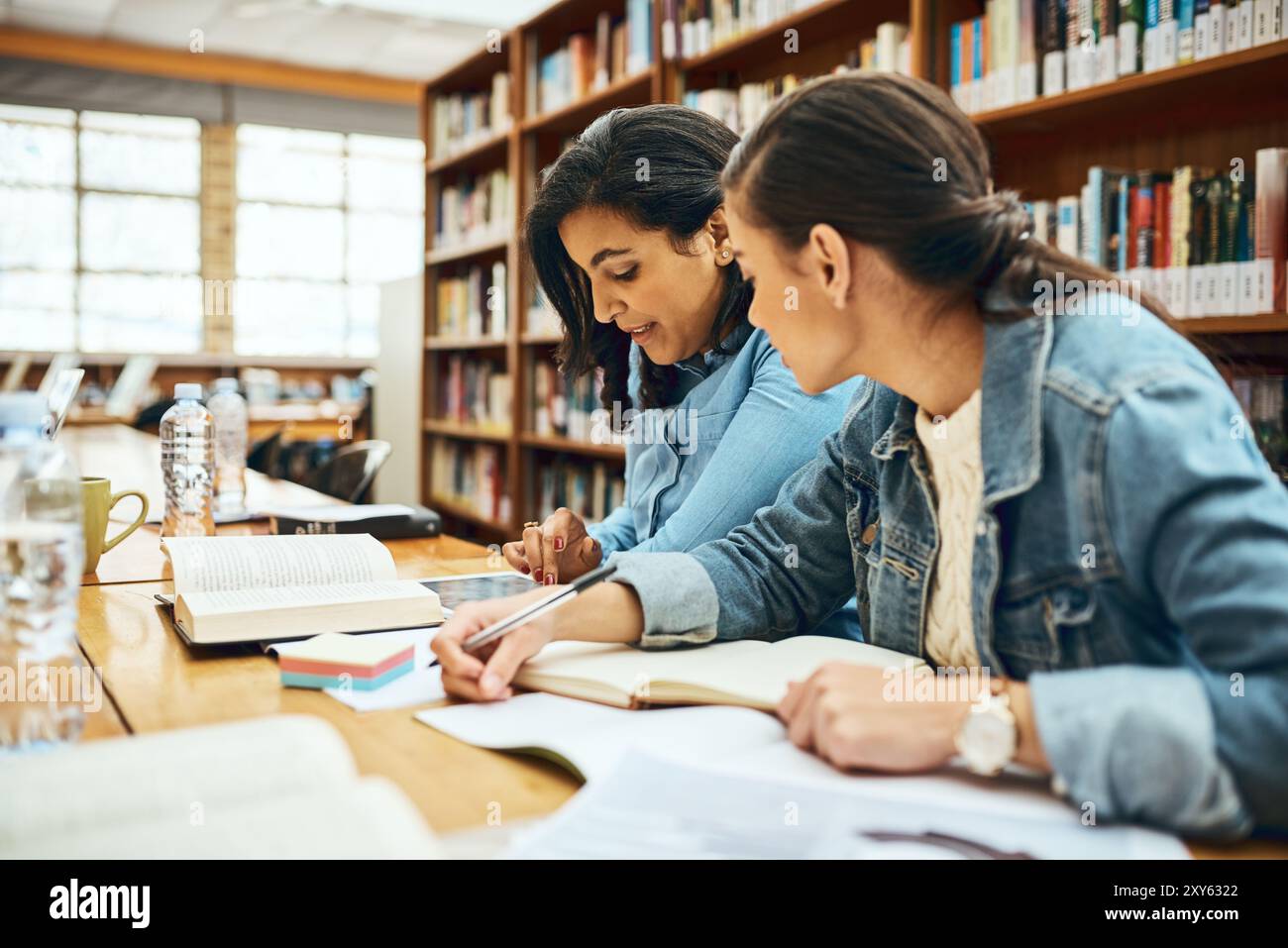 Education, library and girl student friends on college or university ...