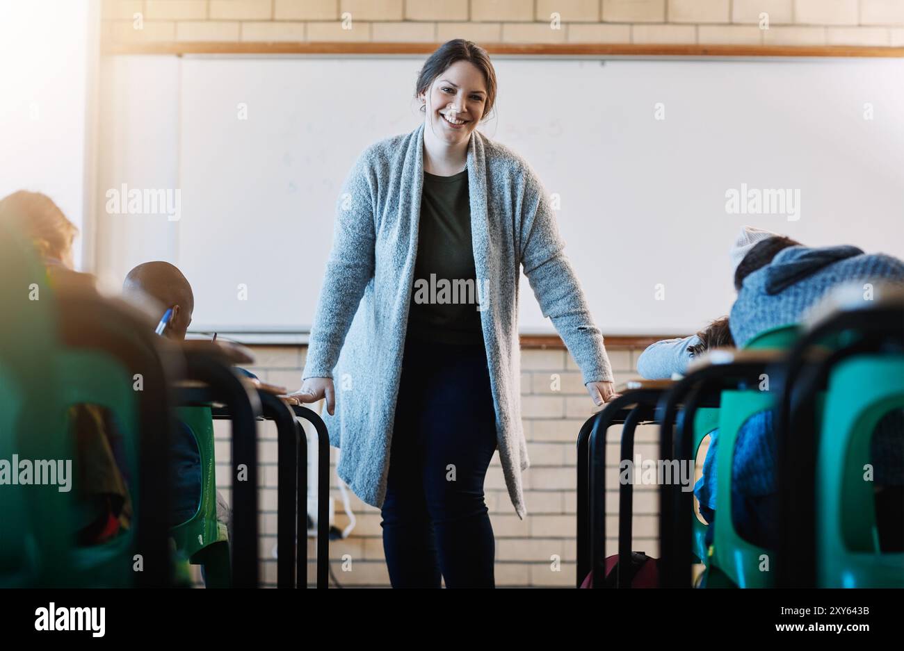Happy woman, portrait and teacher with school kids for classroom ...