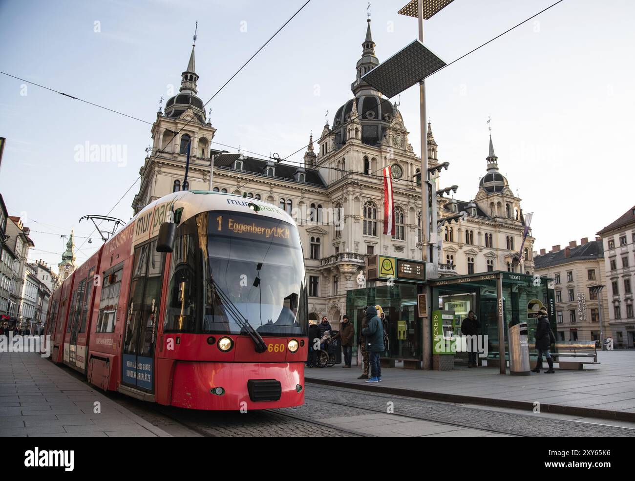 Austria, 20.01.2019: The Graz town hall, street red tram arriving to ...