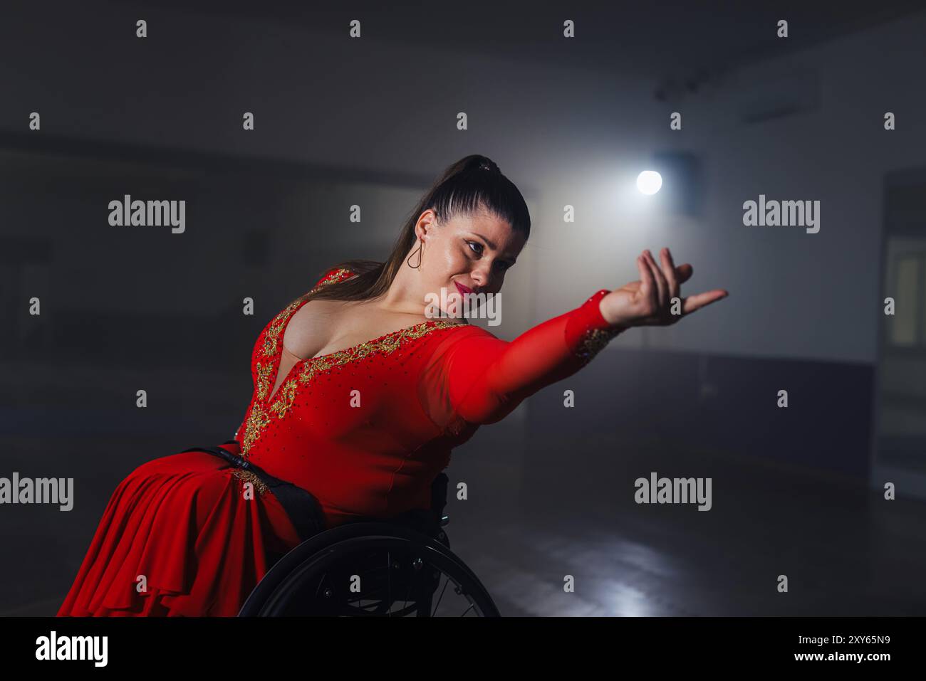 Beautiful dance in a wheelchair of a woman with disability at a dancing ...