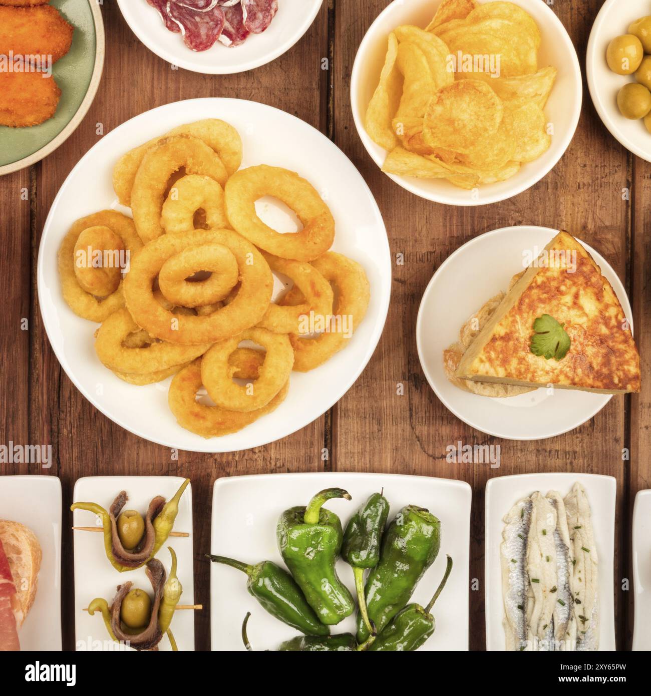 Spanish tapas, a variety of snacks. Squid rings, tortilla, sardines ...
