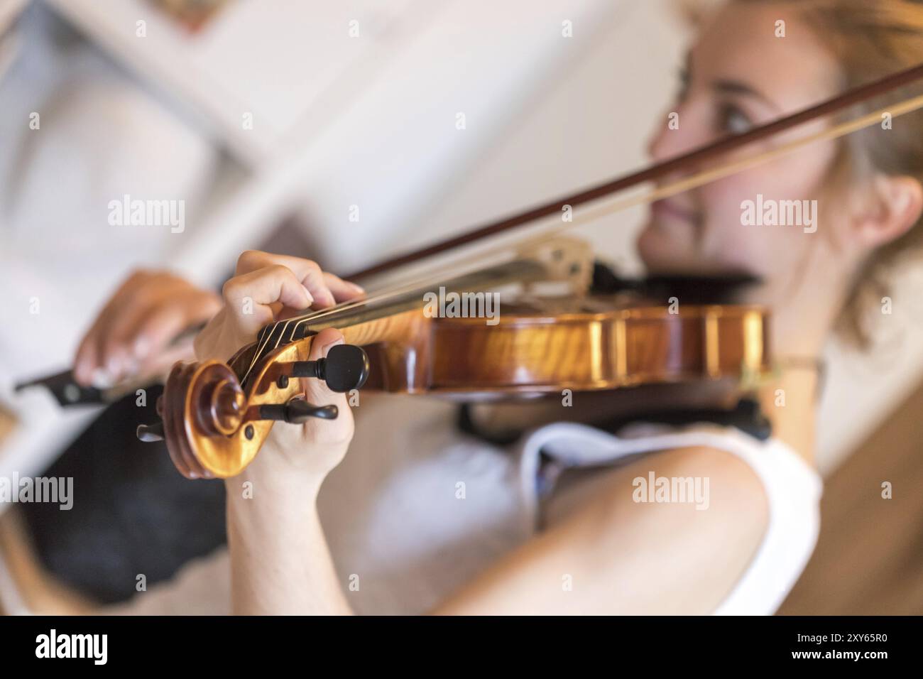 Pretty young girl practices on her violin, acoustic music Stock Photo ...