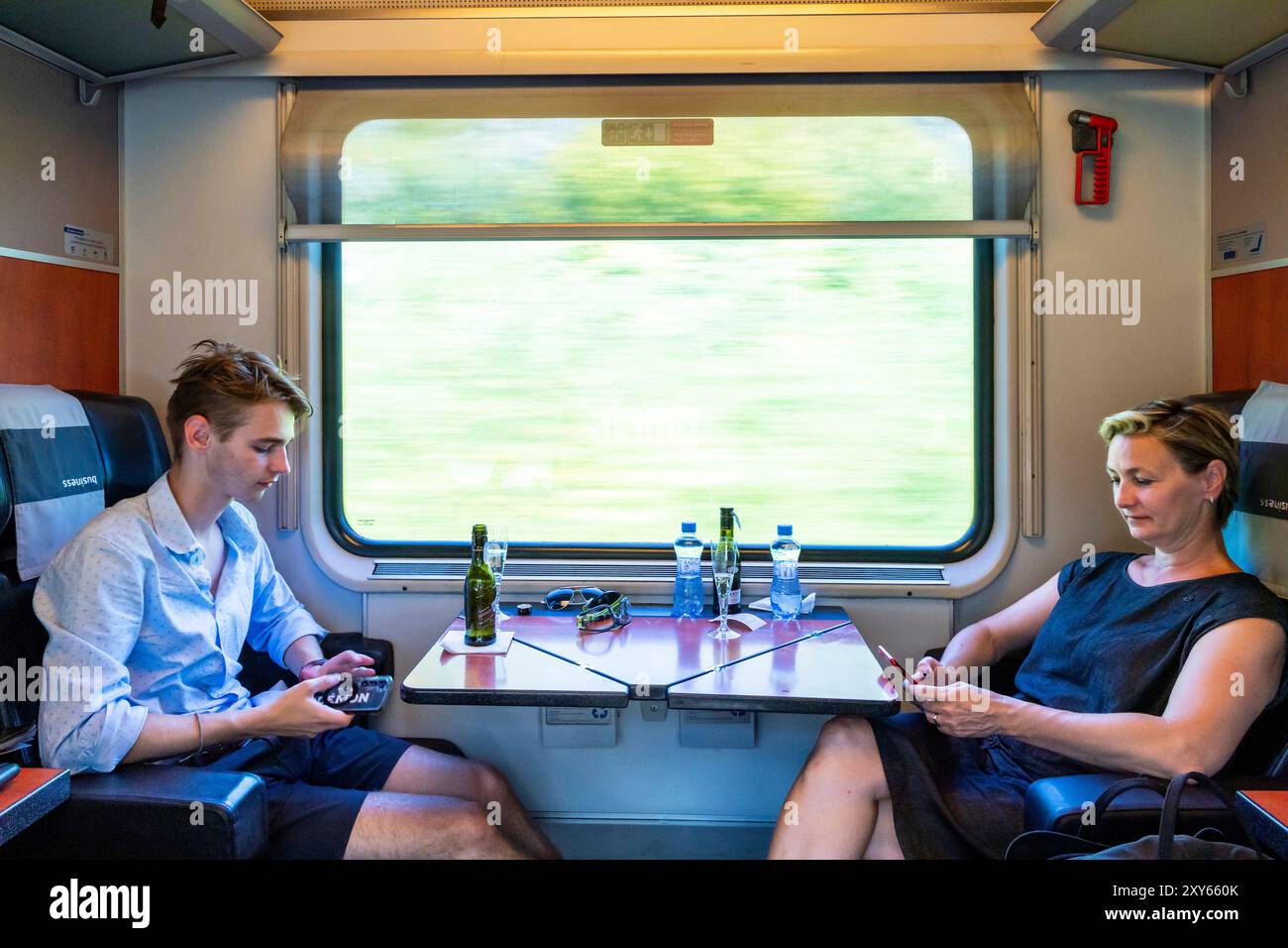 mother with adult son in the train compartment Stock Photo - Alamy