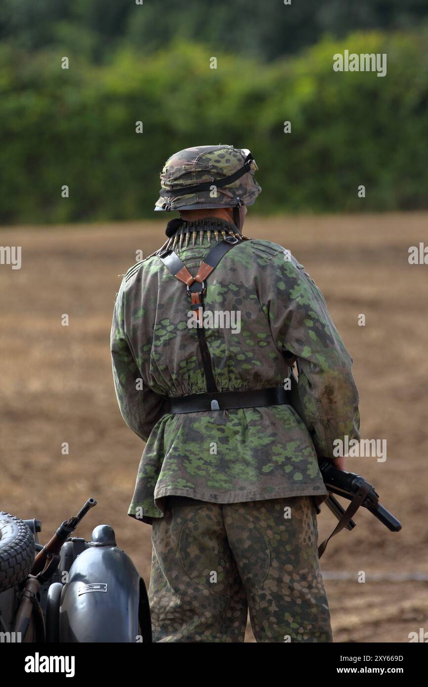 A re-enactor playing a Waffen SS soldier at a re-enactment event Stock ...